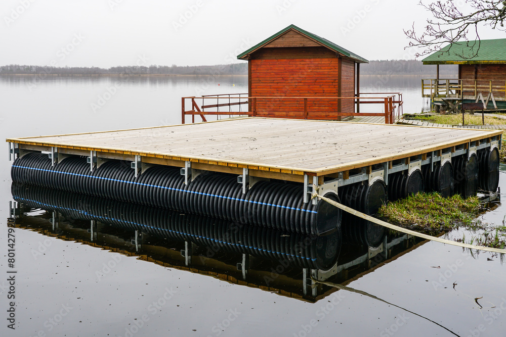 Large floating wooden platforms on pontoons with holiday houses in the ...