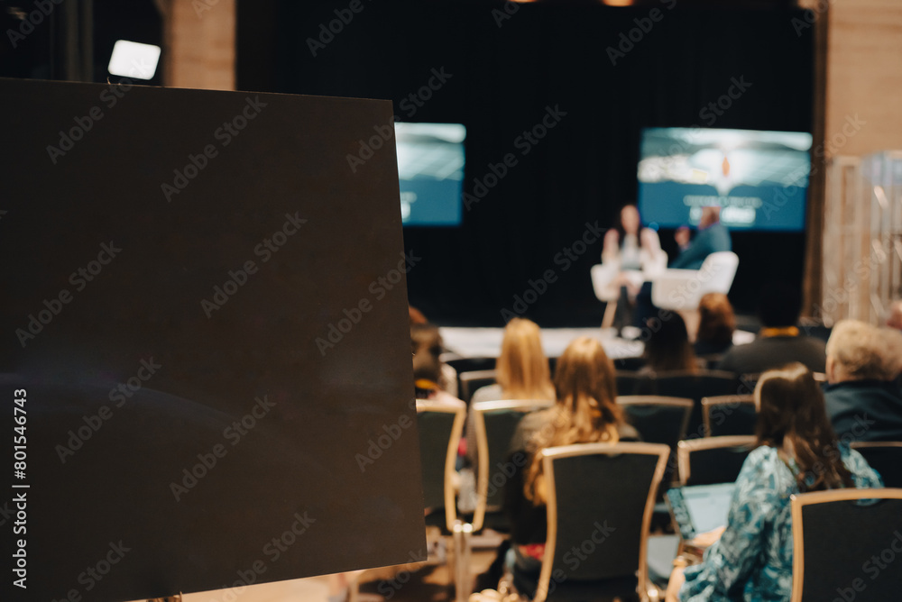 Blurred reporters cover working at business conference convention ...