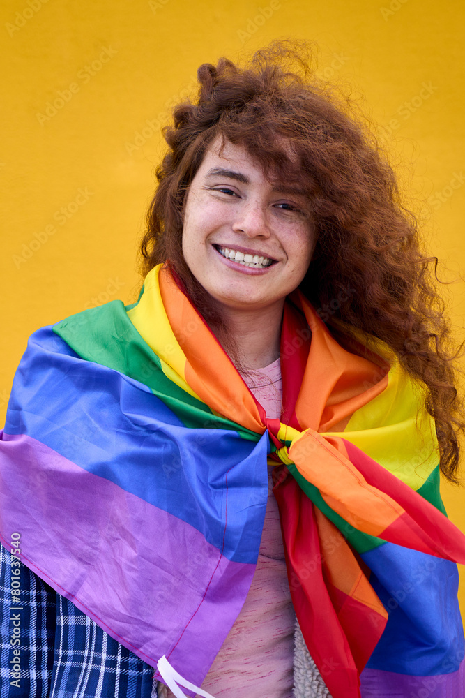 Vertical. Portrait of cheerful non-binary person with red hair with ...