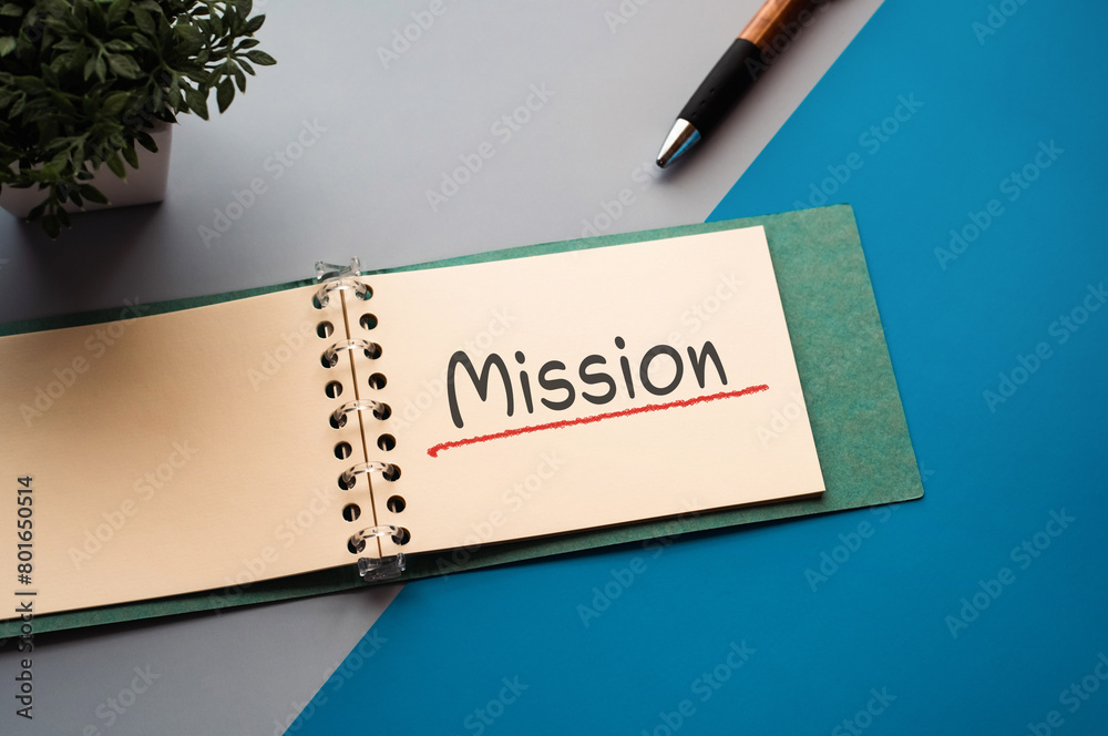 There is notebook with the word Mission. It is as an eye-catching image ...