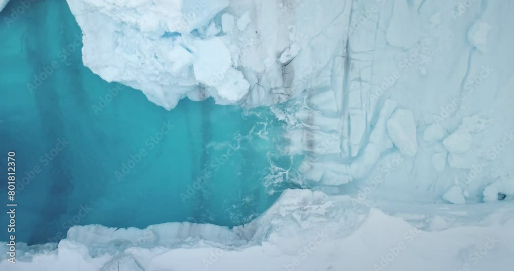 Vidéo Stock Frozen ice cave with blue pool of water washed by ocean ...