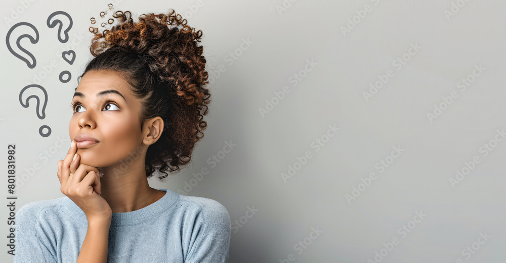 Woman thinking with question marks floating above her head on light ...
