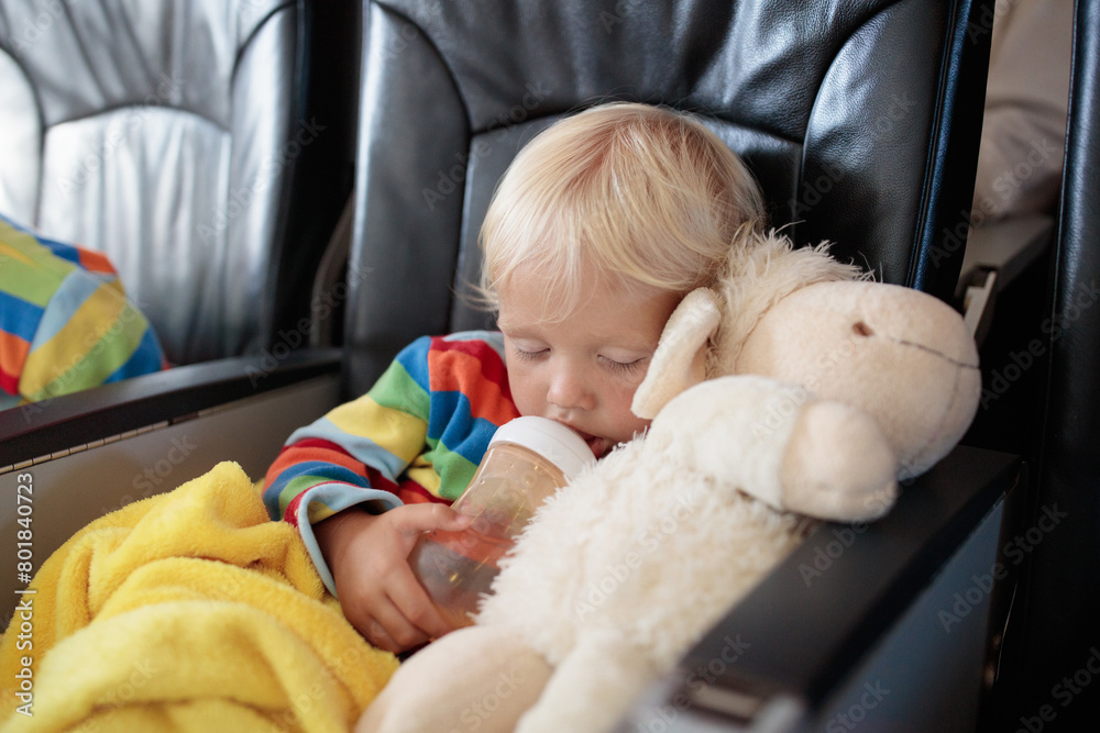 Child flying in airplane. Flight with kids. Stock Photo | Adobe Stock