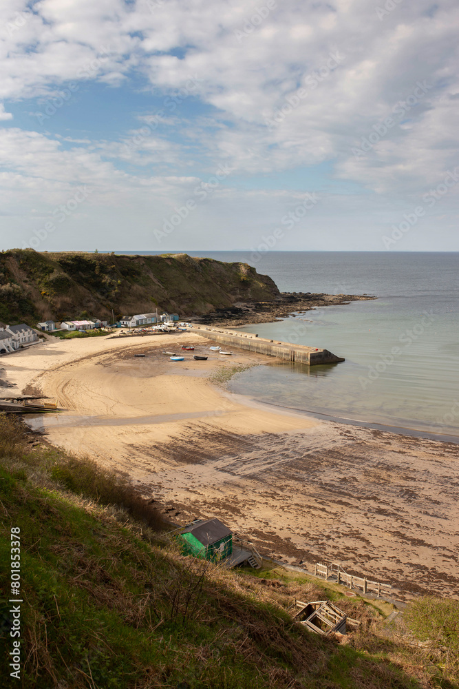 Porth Nefyn harbour and Nefyn beach viewed from on top of a cliff in ...