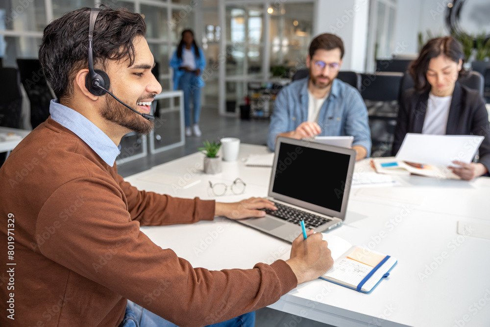 Ambitious employees working in professional coworking space Stock Photo ...