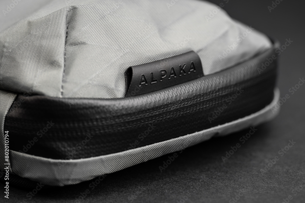 Dnipro, Ukraine - 30.03.2024: men belt bag "alpaka" studio shoot. Dark designer banana bag ...