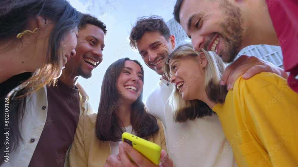 Young group of gen z people having fun using cell phone together ...