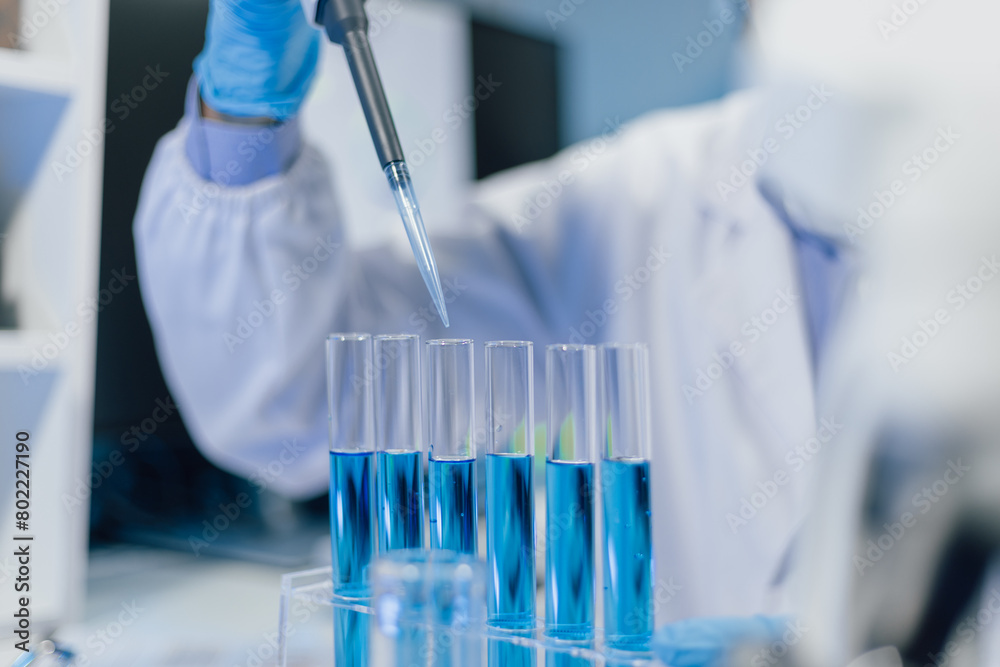 Medical Research Laboratory, Doctor scientist using micro pipette for ...