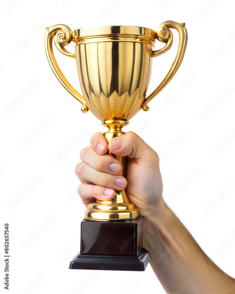 hand holding a golden trophy cup, victory or success concept. on a ...