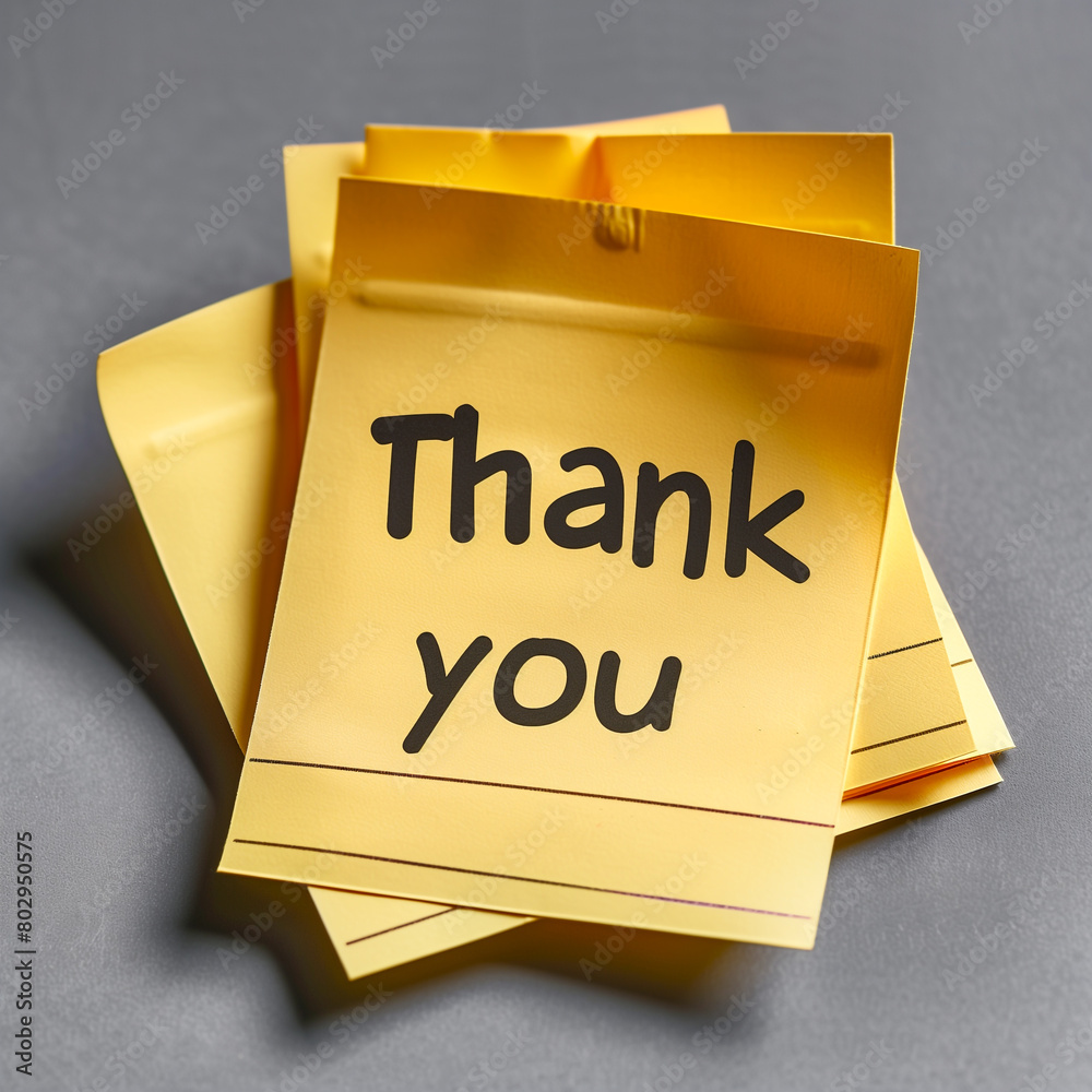 Thank you message on sticky notes against a gray background ...