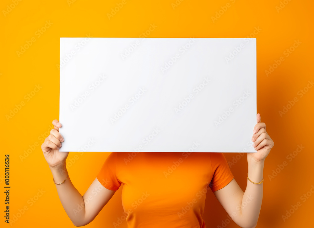 Headless woman holding blank sign, orange background. Stock Photo ...