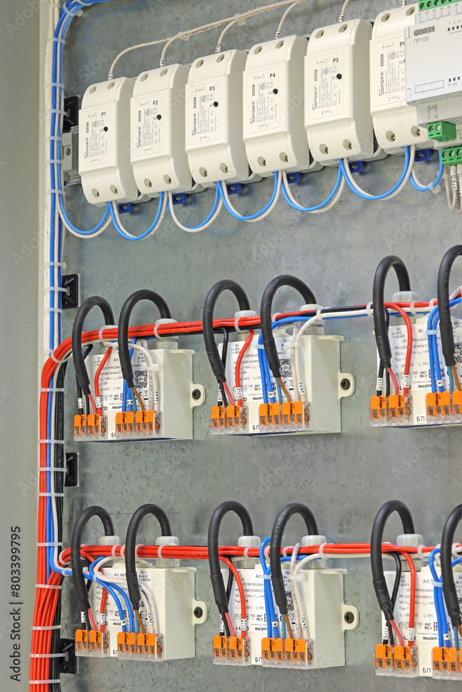 Electronic control modules for apartment automation are installed in an ...