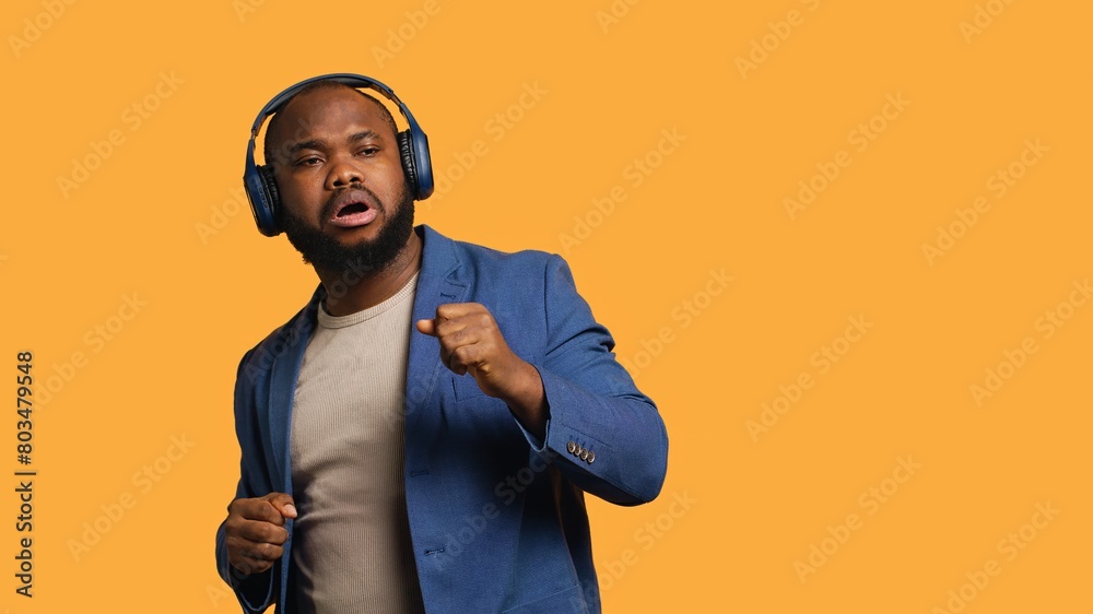 Carefree man listening energic music, raving on rhythm, enjoying free ...