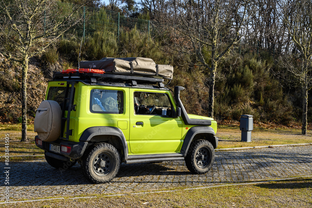 Suzuki Jimny green yellow, phosphor, prepared for an overland trip ...