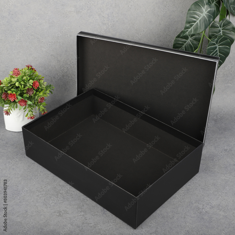 Black box, mockup, empty box on grey background table, clean black ...