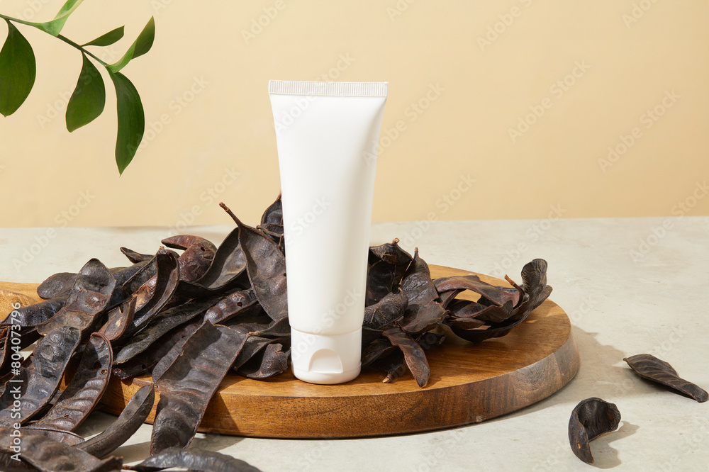 Unlabeled tube standing on cutting board with lots of black locust ...