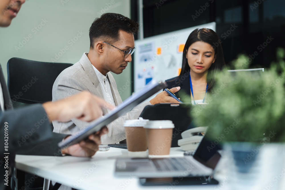 Asian business people working as a good team in the office. Successful ...