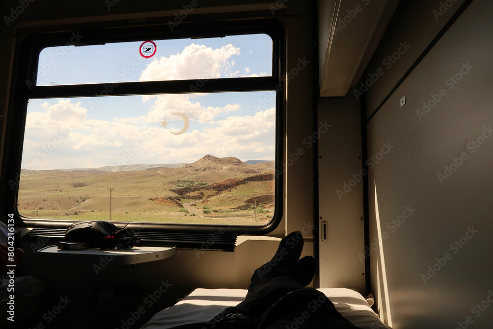 The view out of a window from the bed in the sleeping compartment, on ...