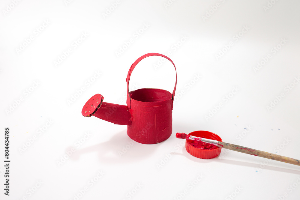 red watering can made of recycled toilet paper roll, colored by kids ...