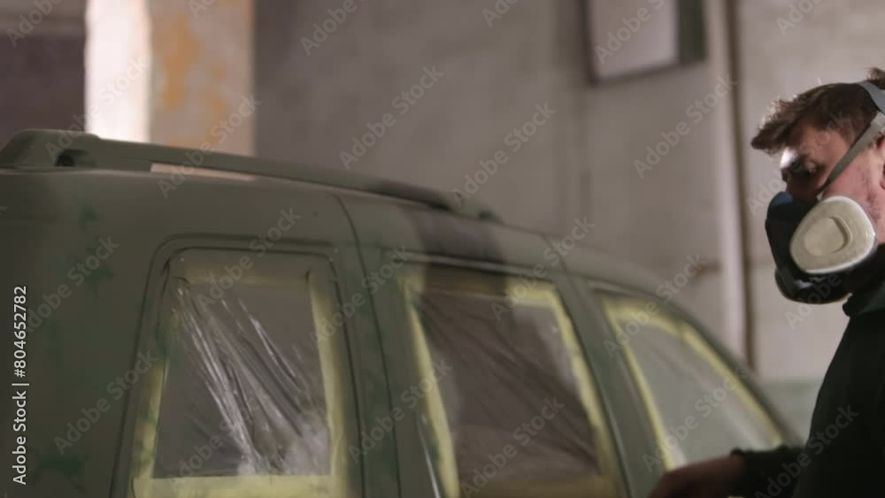 Masked painter, Precision technique, Auto perfection. Person, intent ...