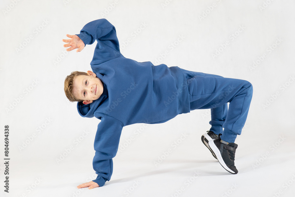 Boy in breakdancing position.Hip hop dance. Bboying basics. Boy in a ...