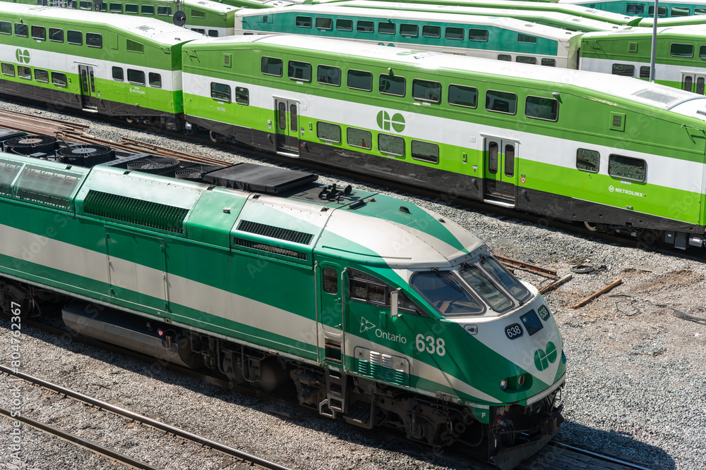 Go Transit engine and wagons at rail corridor converging on a major ...