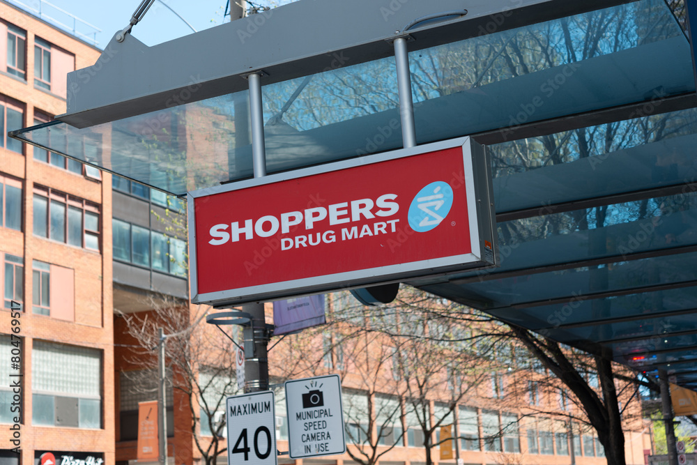 hanging sign of Shoppers Drug Mart located here at 18 Lower Jarvis ...