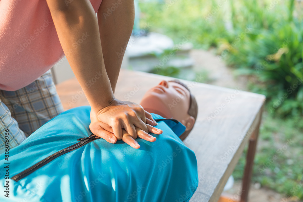 Close-up of young Asian female hands performing cardiopulmonary ...