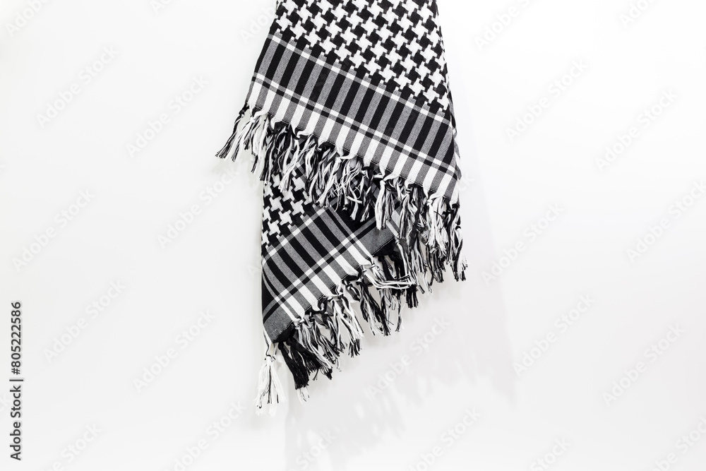 A traditional pattern head-tied garment 'Keffiyeh' or 'Puşi' on a white ...