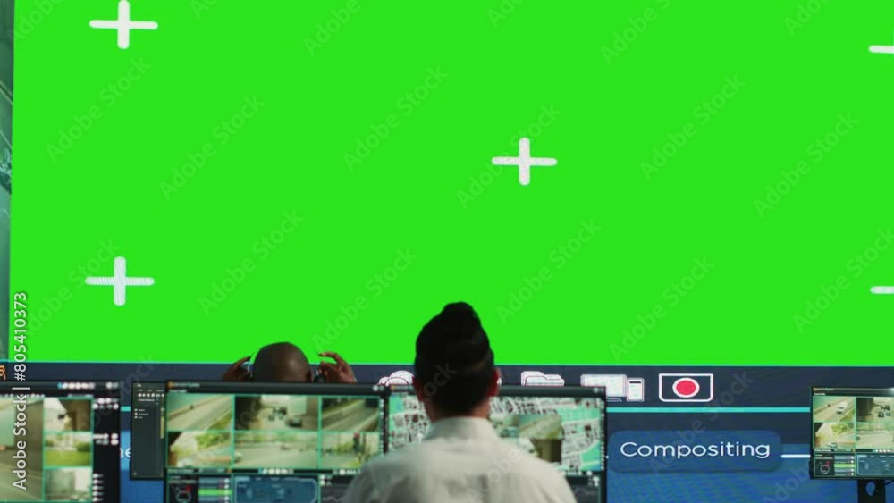 Courier agency operators monitoring cargo shipment with a greenscreen ...