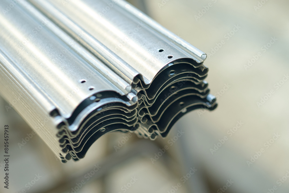 Metal steel roller shutter blinds stacked up on an industrial heavy ...