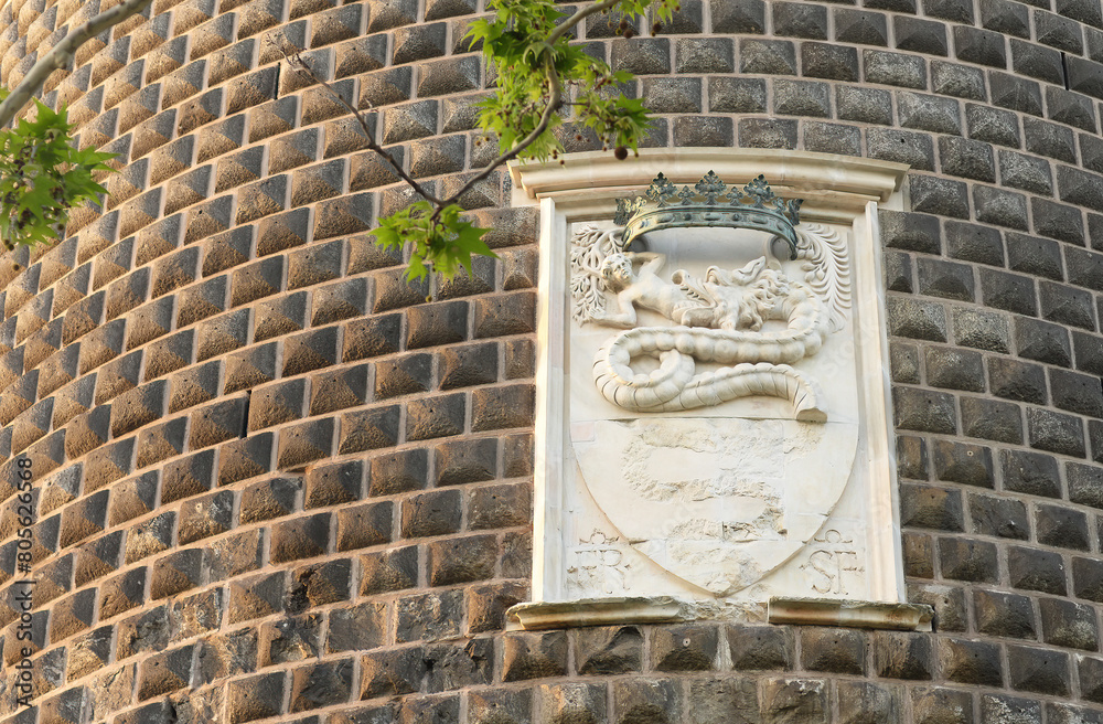 Damaged Coat of Arms of the Sforza Family in the stone wall of one of ...
