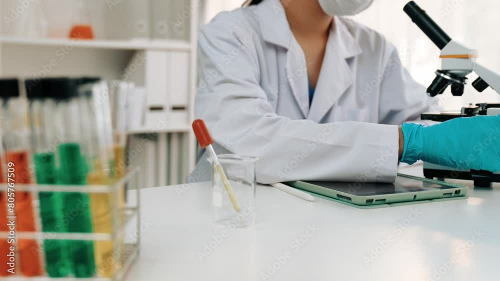 Laboratory chemistry researcher develop new medicine or cure using ...