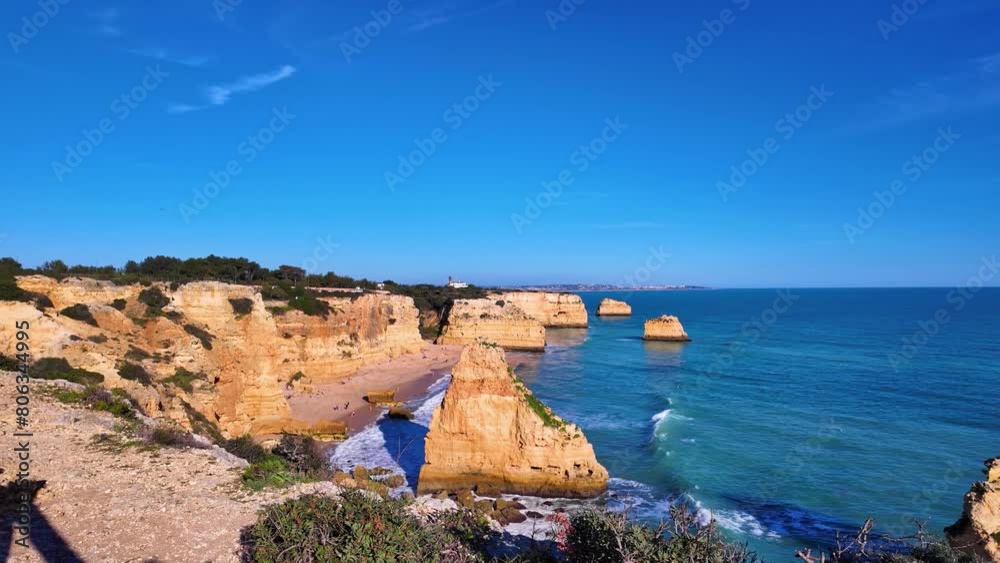 Praia da Marinha Beach among rock islets and cliffs seen from Seven ...