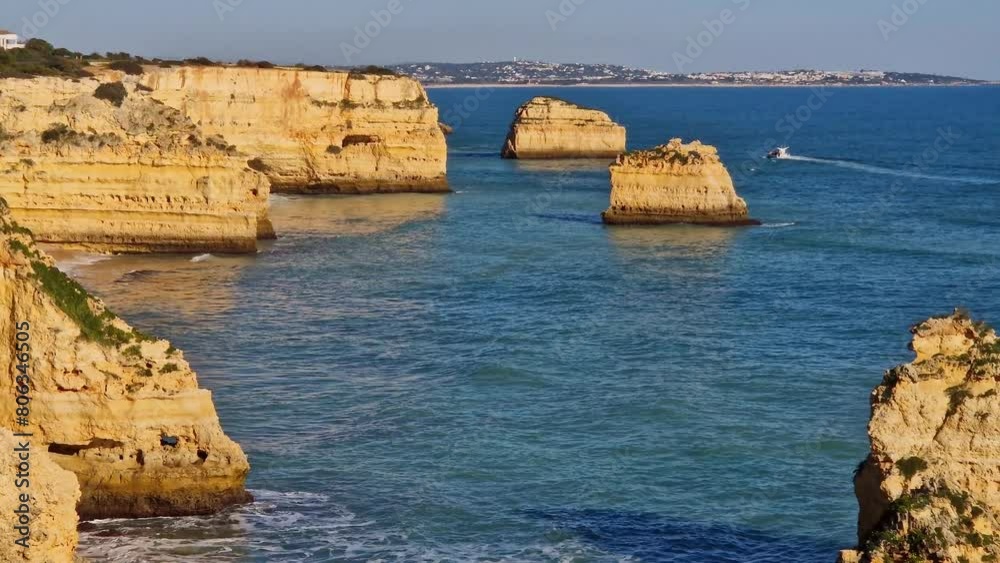 Praia da Marinha Beach among rock islets and cliffs seen from Seven ...