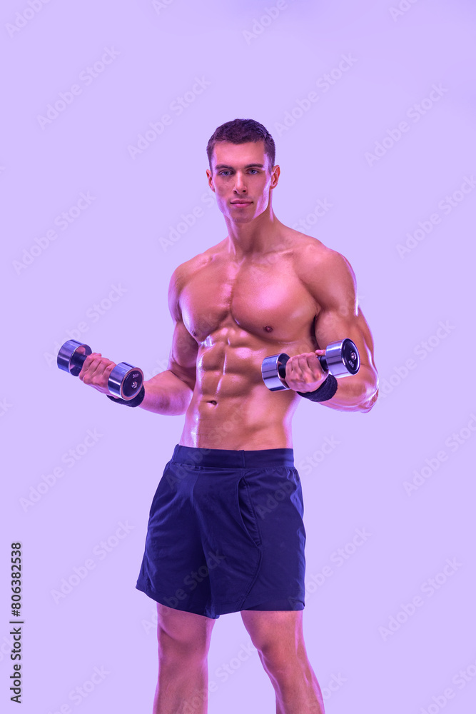 Man athlete with dumbbell on pink background. Gym full body workout ...