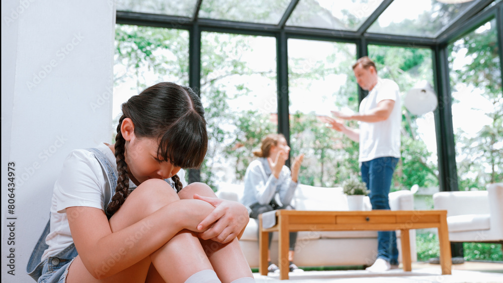 Stressed and unhappy young girl huddle in corner, cover her ears ...