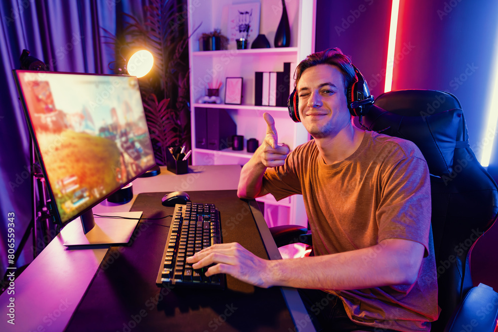 Host channel of smart gaming streamer looking at camera with playing ...