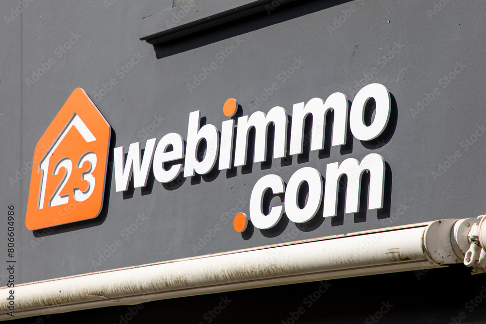 webimmo brand sign and logo text front of office real estate store broker agency webimmo.com ...