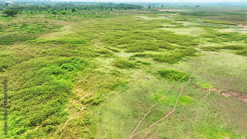 Aerial view, A parched landscape stretches beyond a dam with receded ...