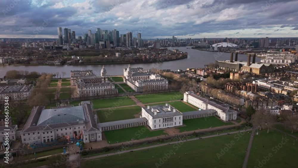 This aerial shot showcases the Thames River serpentine flow past iconic ...