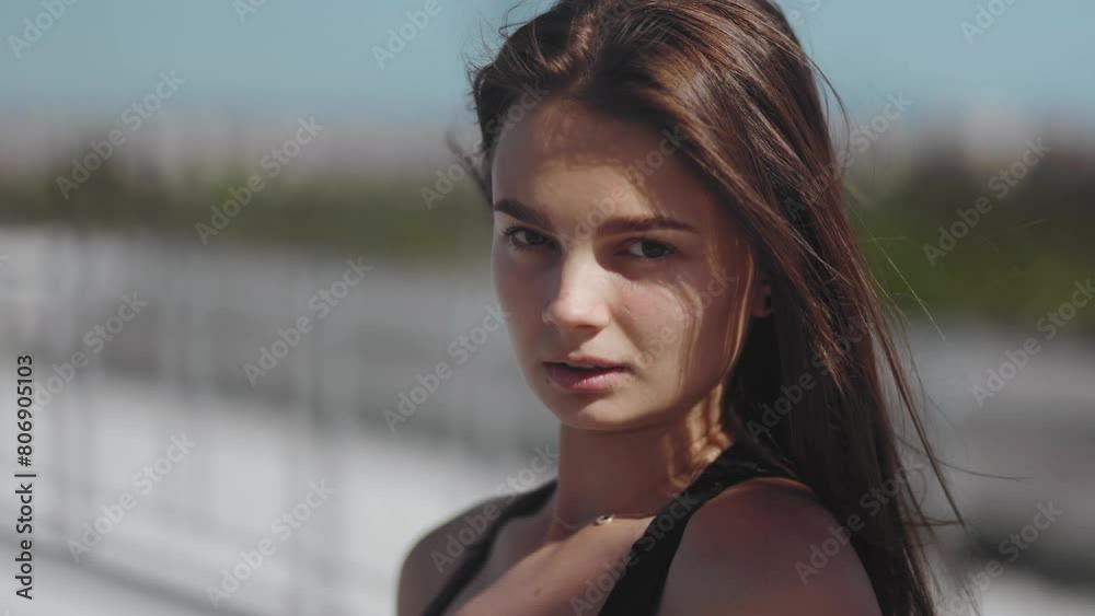 Close portrait of a girl, model, looking at the camera and posing, eye ...