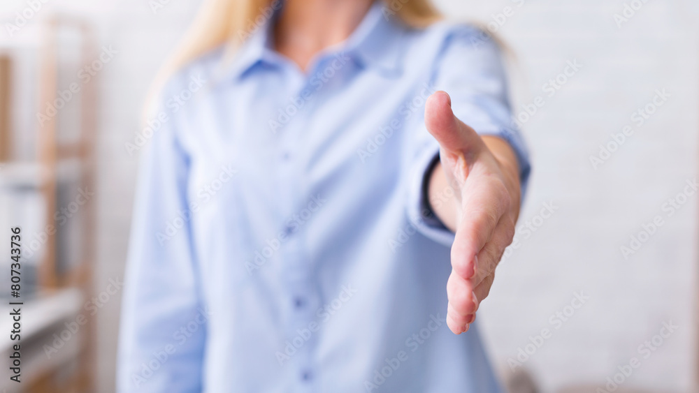 Politeness and good manners at work. Female helping hand extended at ...