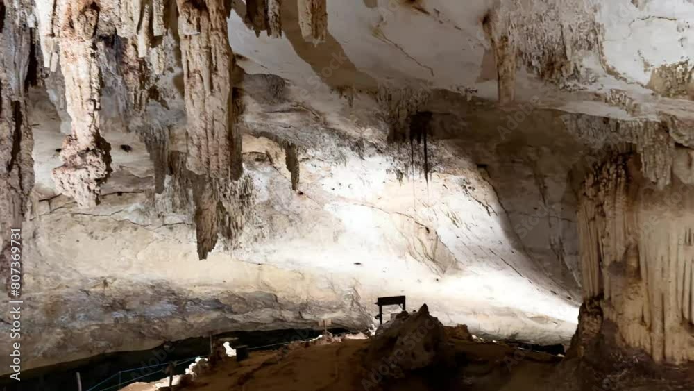 The eerie and expansive interior of a limestone cave, adorned with ...