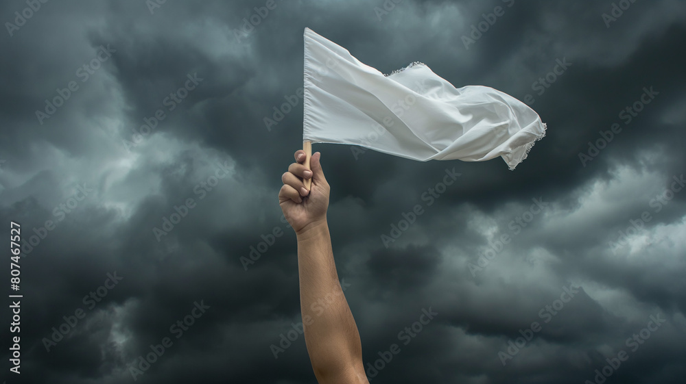 hand rise with white flag for surrender or peace sign against dramatic ...