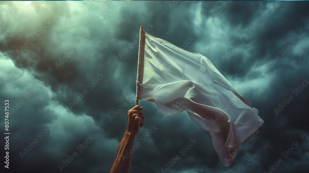 hand rise with white flag for surrender or peace sign against dramatic ...