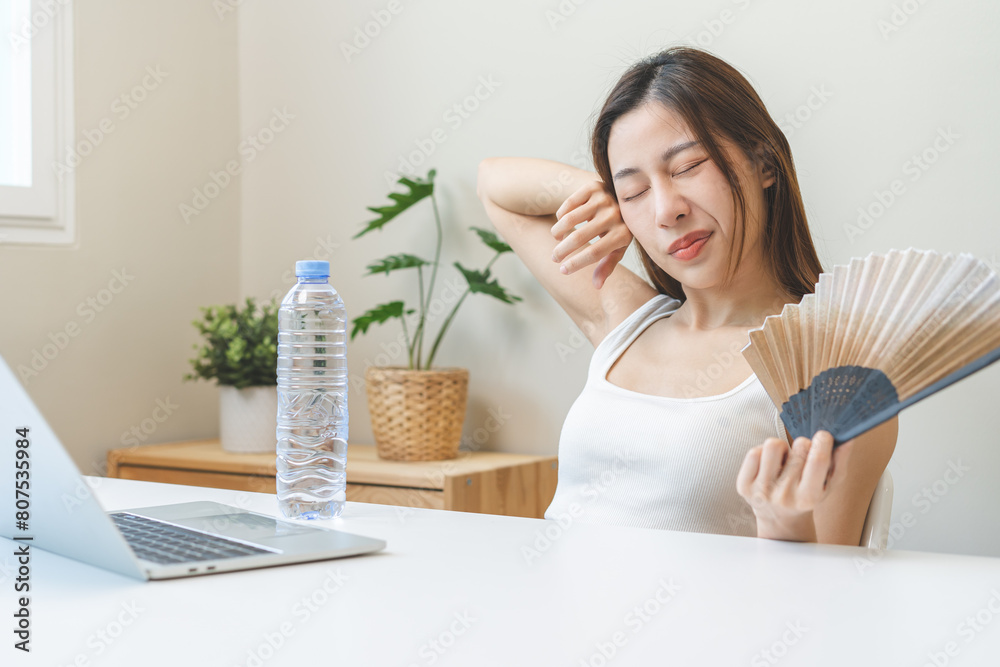 Suffering summer heat wave stroke, hot weather, tired asian young woman ...