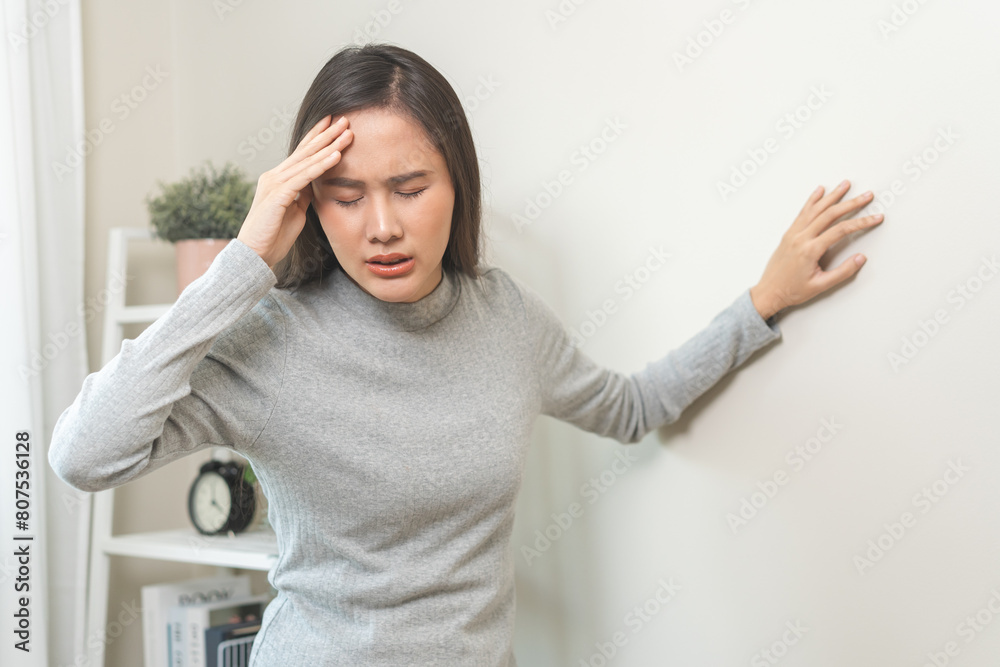 Dizzy asian young woman, girl headache or migraine pain. suffering from ...