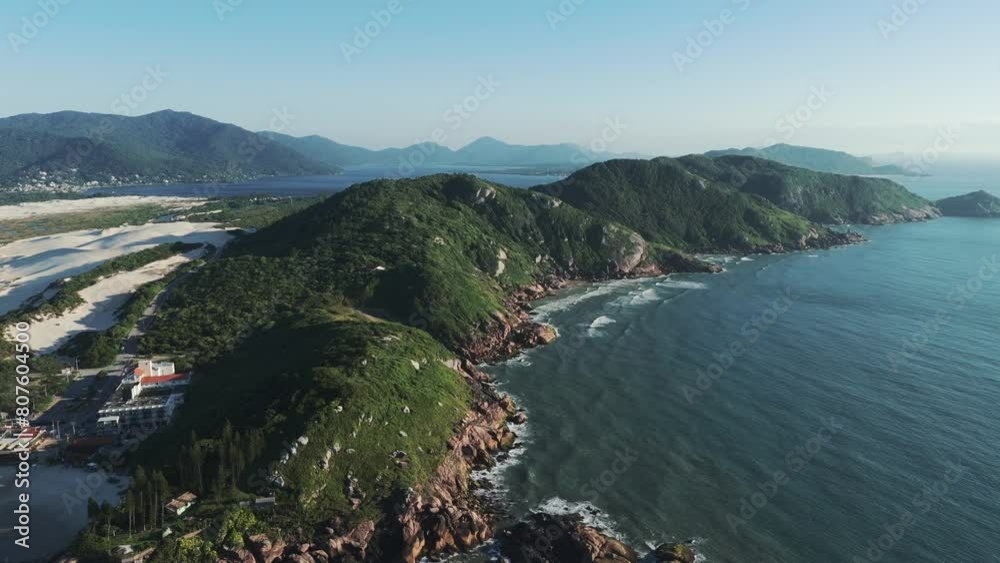 Beautiful green mountains line the Brazilian coastline beside the ...