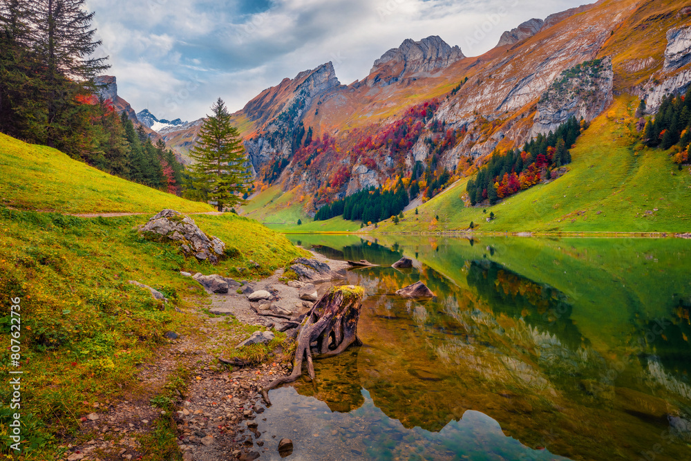 Stunning autumn scene of Swiss Alps with Santis peak on background ...